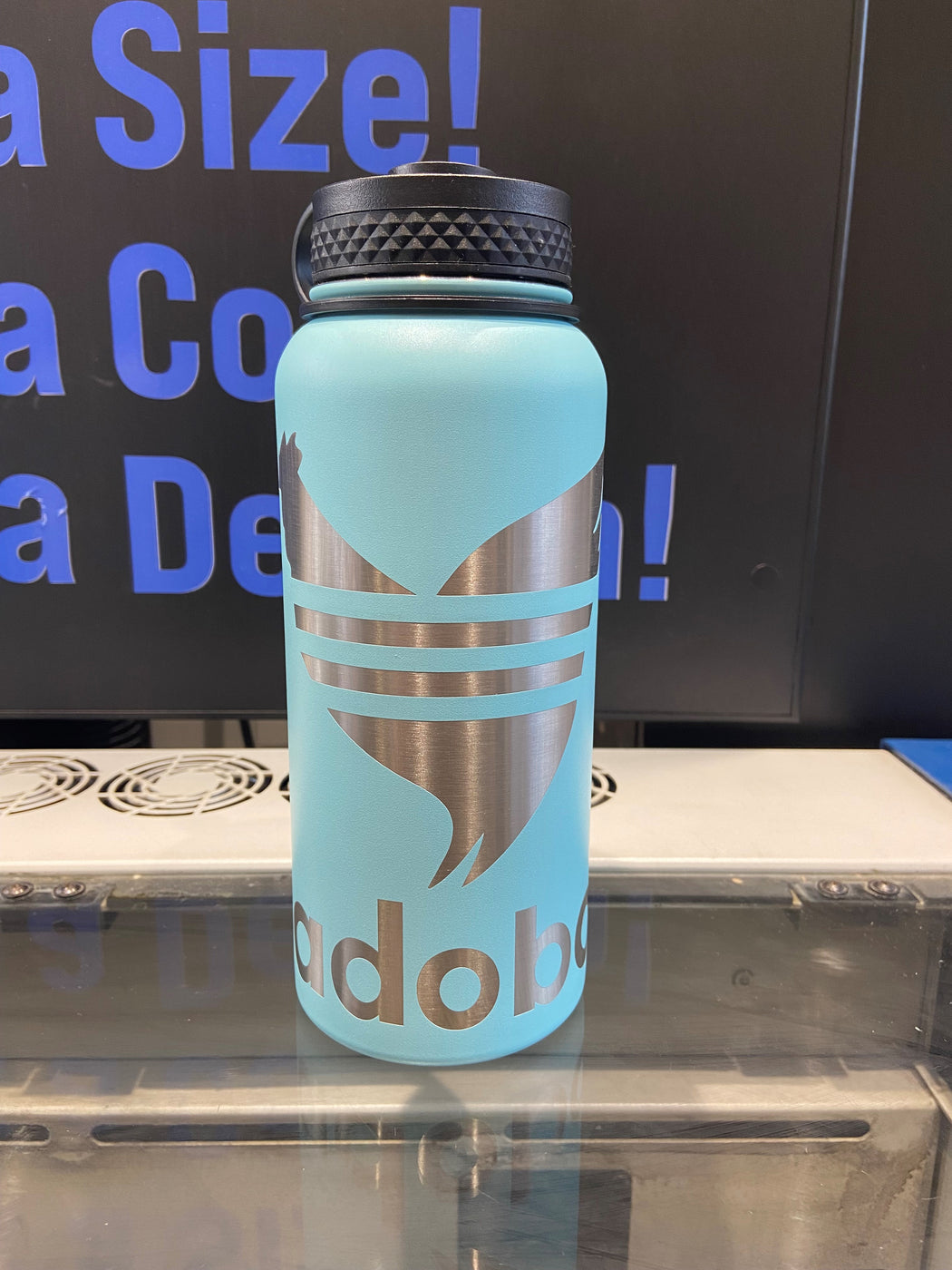 Adobo Logo — Engrave My Flask